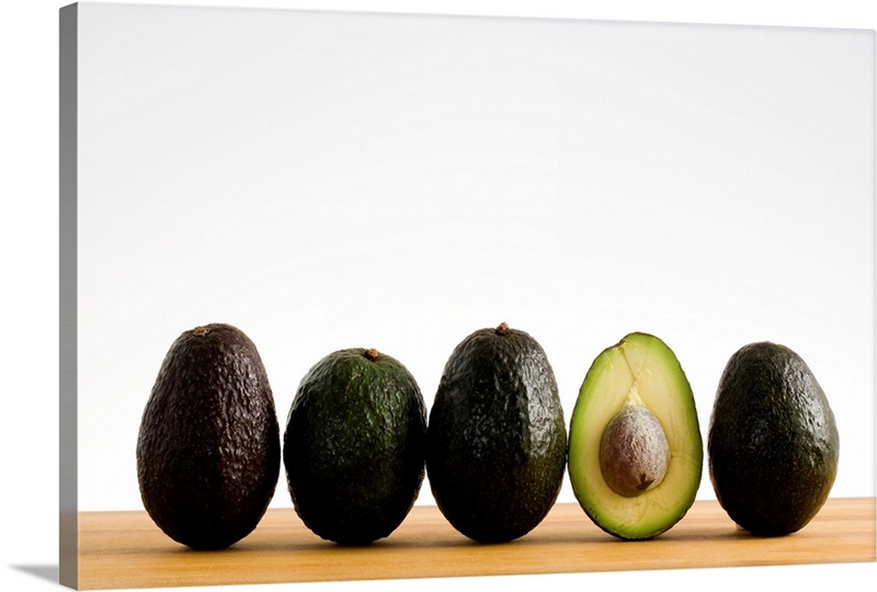 A Row Of Avocados With Interior Of One Showing Standing Upright | Great ...