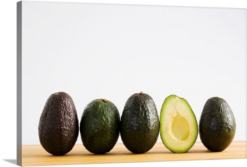 A Row Of Avocados With Interior Of One Showing Standing Upright | Great ...