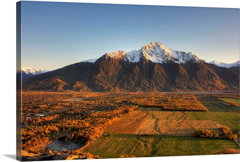 Sunset on Pioneer Peak and farm fields near Palmer, Alaska during ...
