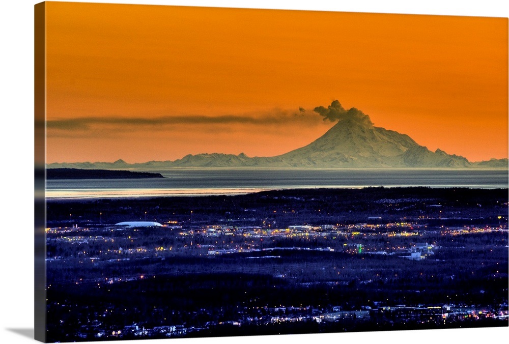 The city of Anchorage Alaska at sunset with Mount Redoubt erupting in ...