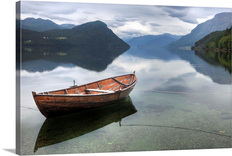 Red rowing boat on a still lake, Norway | Great Big Canvas