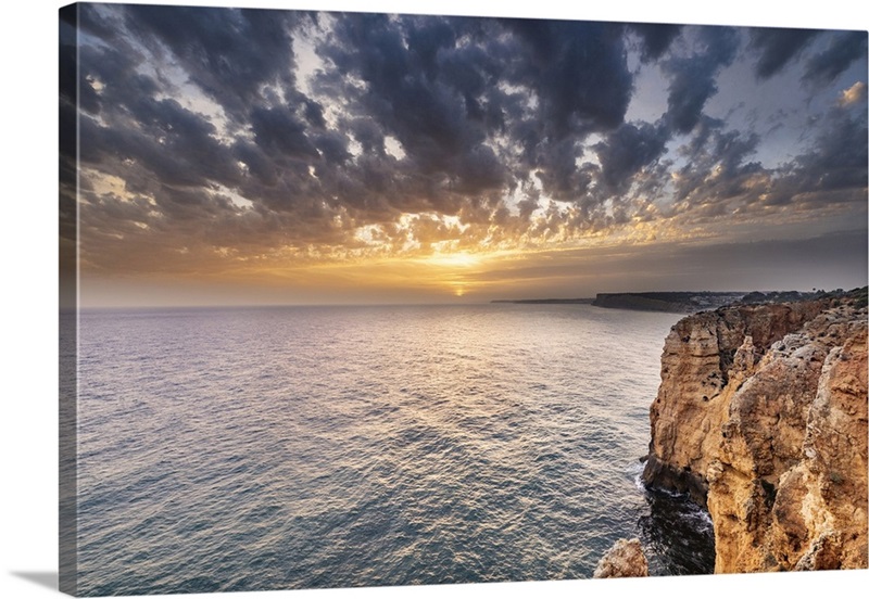 Dramatic Sunset Clouds Over Cliffs Along The Coast At Ponta Da Piedade ...