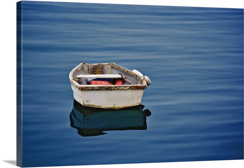 Single small boat floating on ocean, Maine | Great Big Canvas