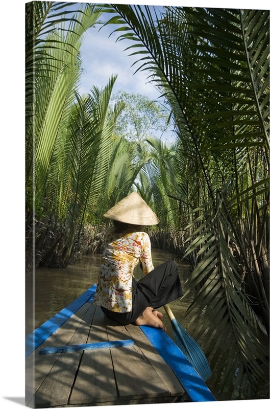 Vietnam, My Tho, Mekong Delta, woman rows among the channels of Dragon ...