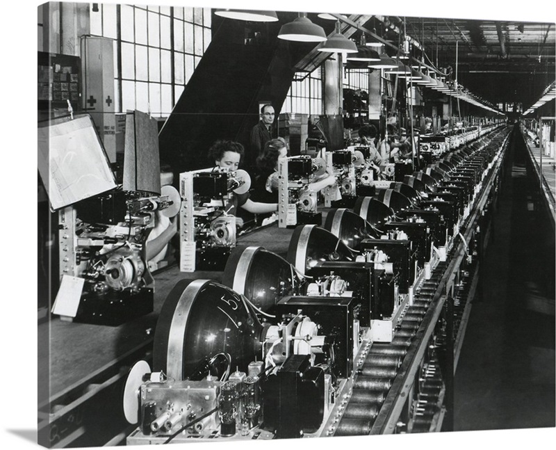 Television chassis on an assembly line with women workers in a US ...