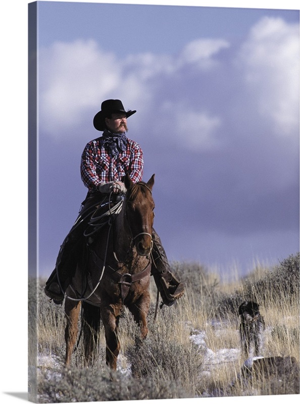 A cowboy poses on his horse with his dog | Great Big Canvas