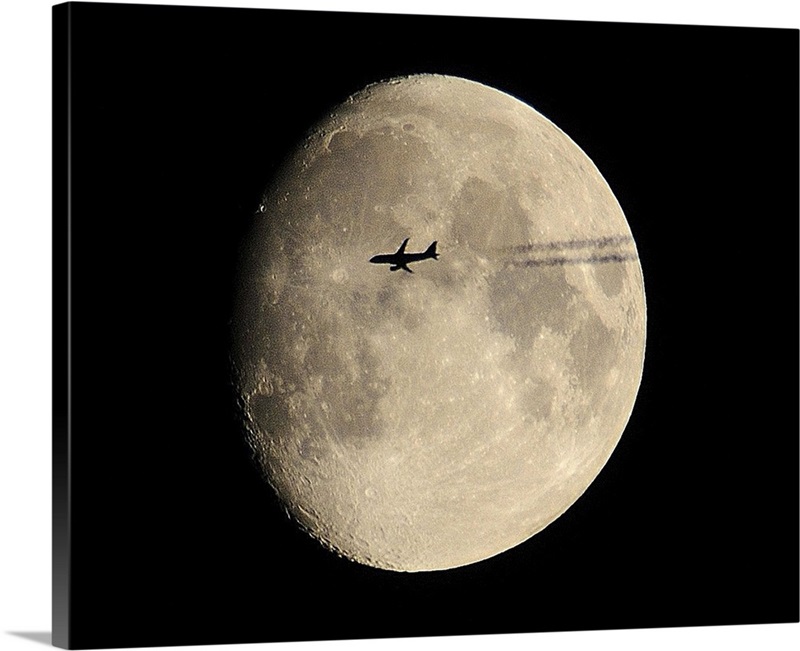 A plane in front of the moon | Great Big Canvas