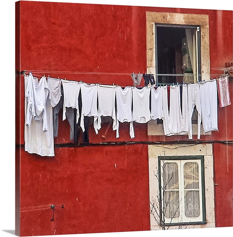 A window with a clothes drying on the clothesline in Lisbon, Portugal ...