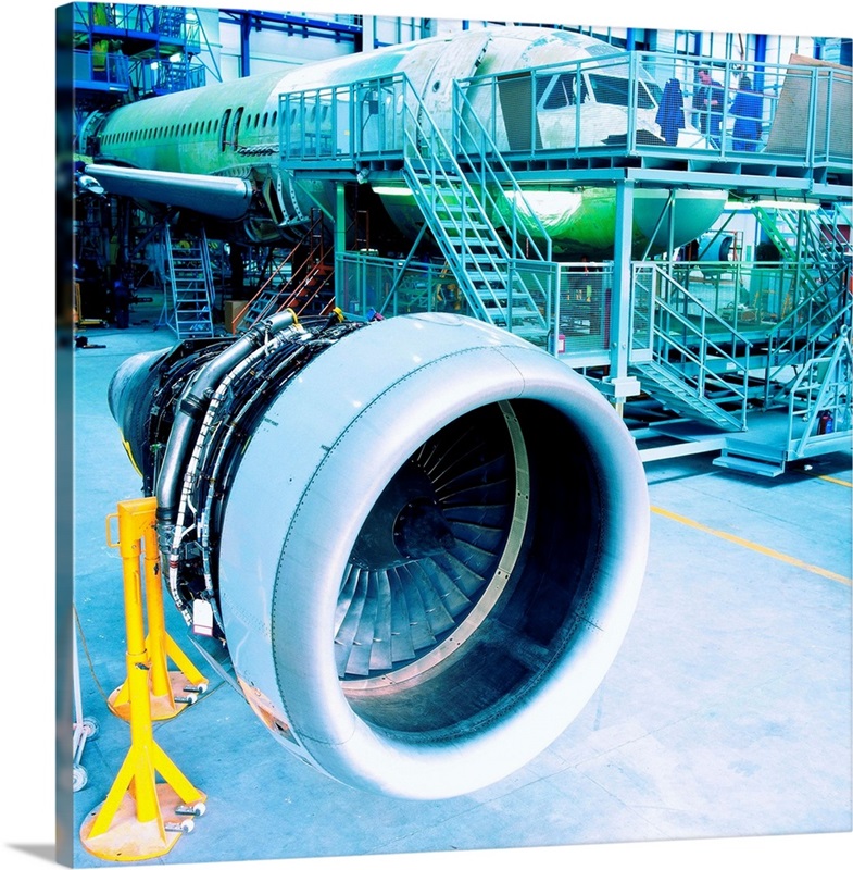 An aircraft engine and aircraft body in a hanger | Great Big Canvas