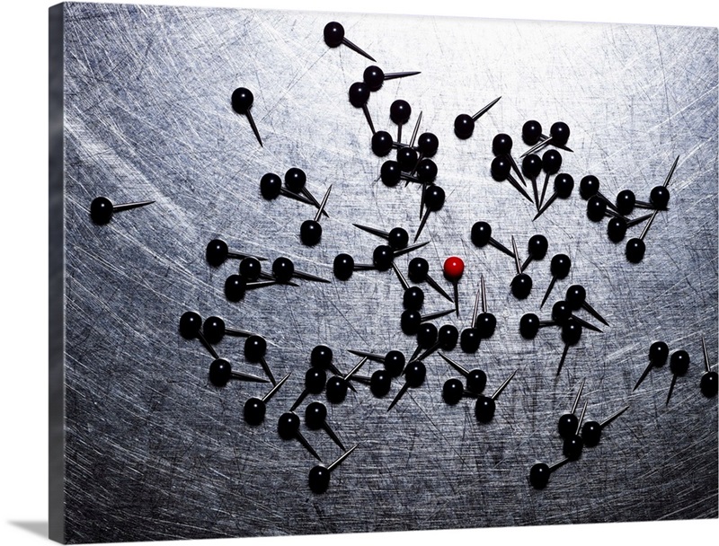 Black map pins with one red pin on stainless steel. | Great Big Canvas