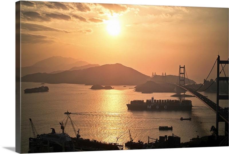 Cargo vessel crossing the bridge at sunset. | Great Big Canvas