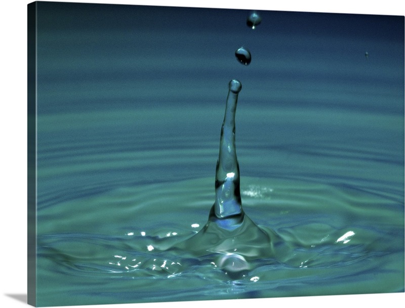 Close-up of a splash created by water falling into a pool (toned ...