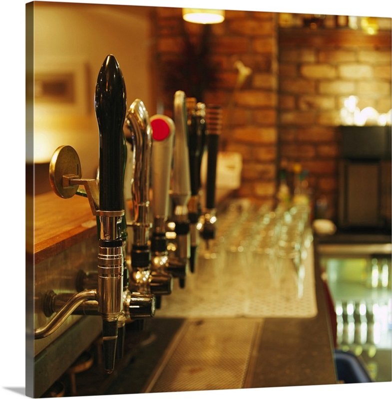 Close-up of beer taps in bar | Great Big Canvas