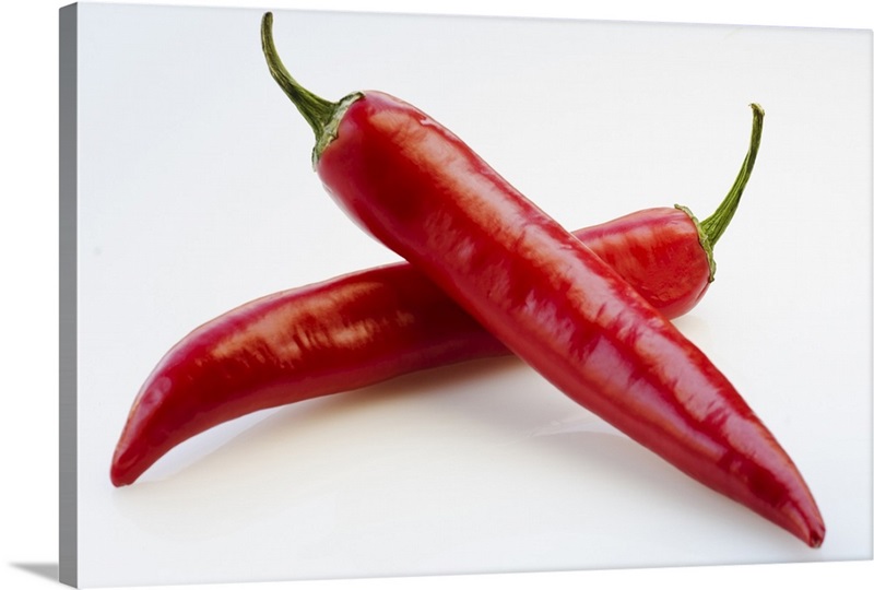 Close up of red chili peppers on white background | Great Big Canvas