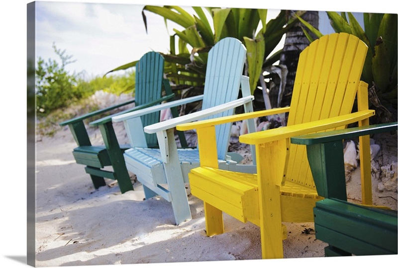 Colored wooden chair on beach | Great Big Canvas