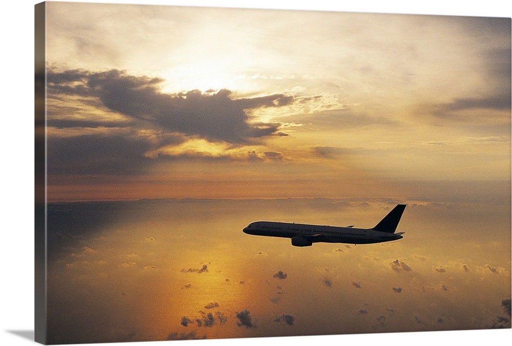 Commercial Aeroplane Flying Above the Sea at Dusk Wall Art, Canvas ...