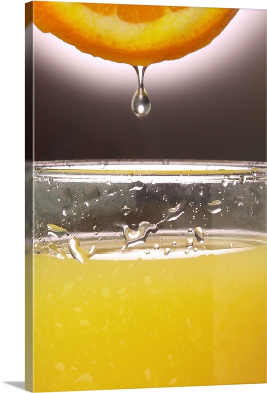 Droplet of orange going into juice | Great Big Canvas