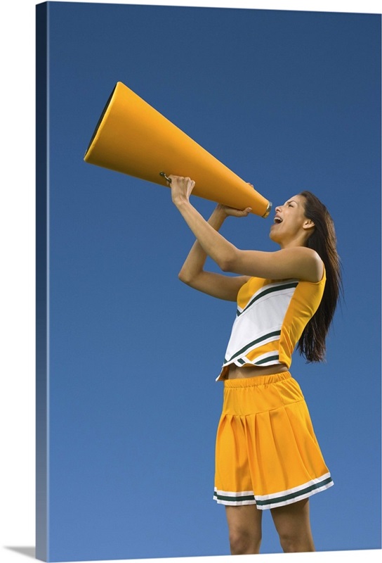 Female cheerleader shouting into megaphone | Great Big Canvas