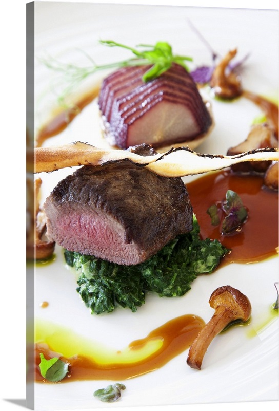 Food are garnish with vegetable and gravy | Great Big Canvas