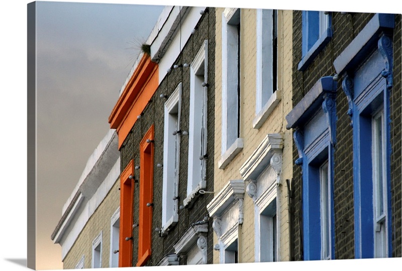Painted window frames on series of terraced buildings on Camden High ...