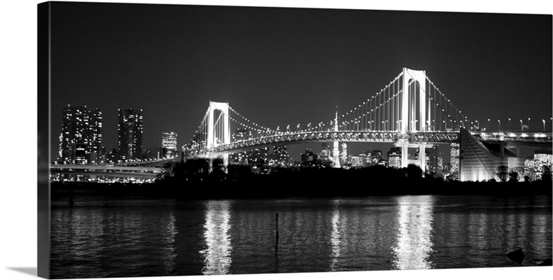 Rainbow bridge with reflection at night. | Great Big Canvas