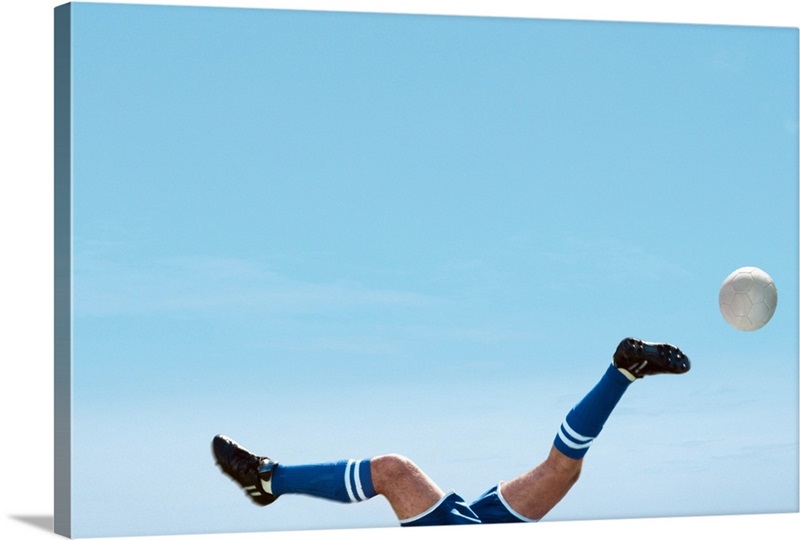 Soccer Player Upside-Down Attempting To Kick The Ball | Great Big Canvas