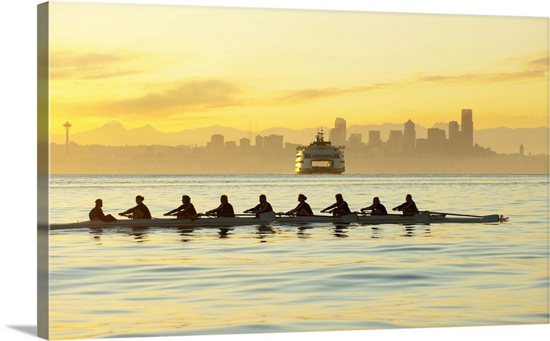 Team rowing boat in bay | Great Big Canvas