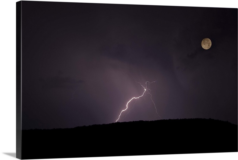 Thunderstorm, thunderbolt lightning, flash over mountain and moon at ...