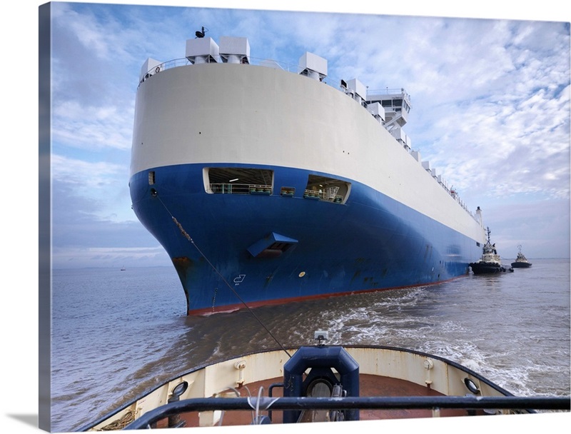 Tugboat pushing large boat out to sea | Great Big Canvas