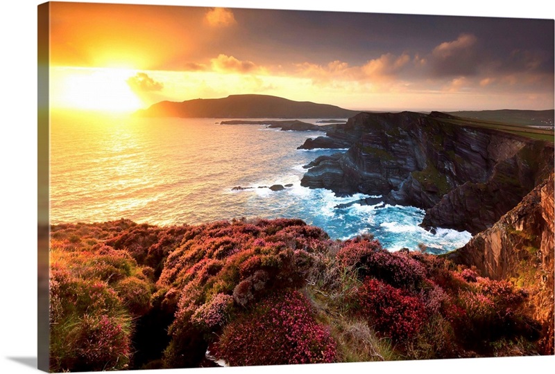 Europe, Ireland, Portmagee cliffs at sunset along the Ring of Kerry ...