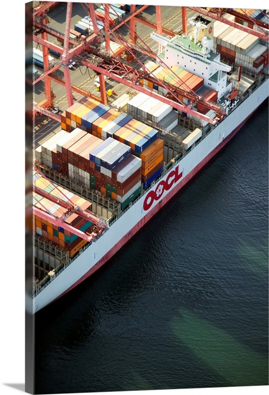 Crane loading cargo onto container ship, Port of Seattle, WA - Aerial ...