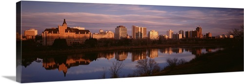 Canada, Saskatchewan, Saskatoon, Buildings along a river | Great Big Canvas
