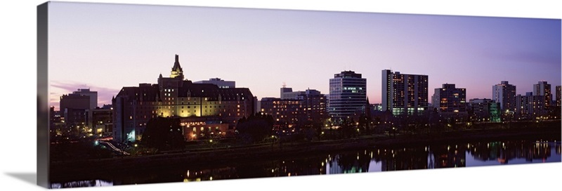 Canada, Saskatchewan, Saskatoon, Buildings along a river | Great Big Canvas