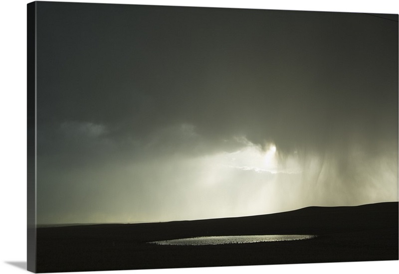 Clouds and sunset light over Middle Fork of Flathead River, water ...