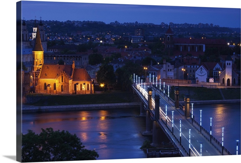 Elevated view of Vytautas Church and Aleksoto tiltas bridge at dusk ...