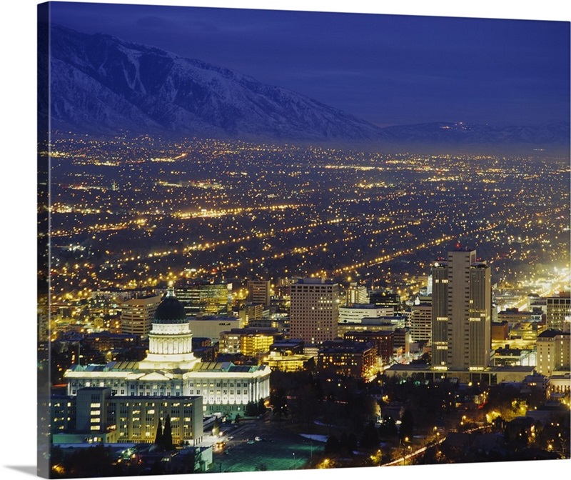 High angle view of buildings lit up at night in a city, State Capitol ...