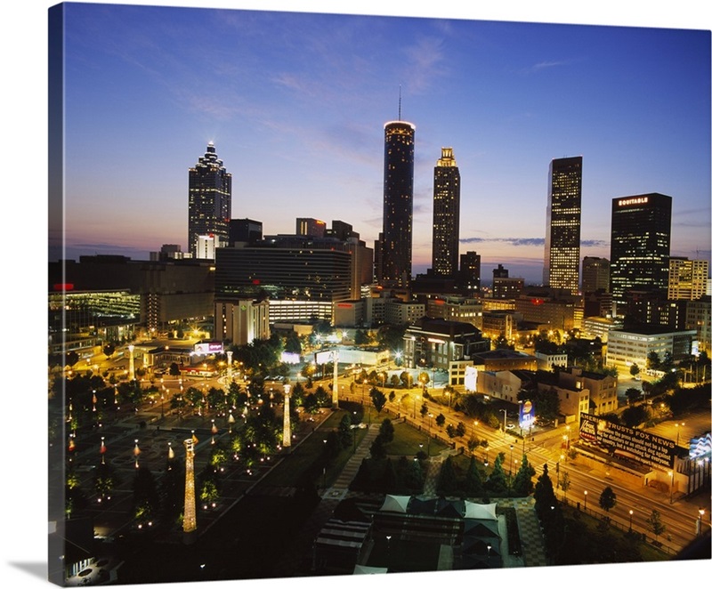 High angle view of buildings lit up at sunset, Centennial Olympic Park ...