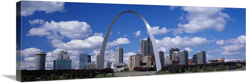 Metal arch in front of buildings, Gateway Arch, St. Louis, Missouri ...