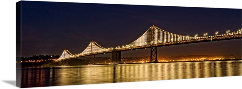 Suspension bridge over Pacific ocean lit up at night, Bay Bridge ...