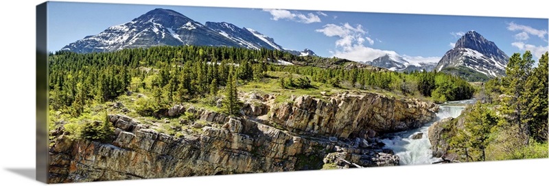 Waterfalls at base of a lake, Swiftcurrent Lake, Glacier National Park ...