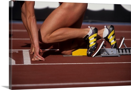 Detail of female sprinter in the starting blocks | Great Big Canvas