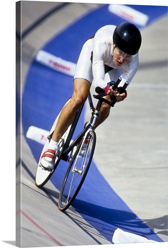 Female cyclist racing on the velodrome track | Great Big Canvas