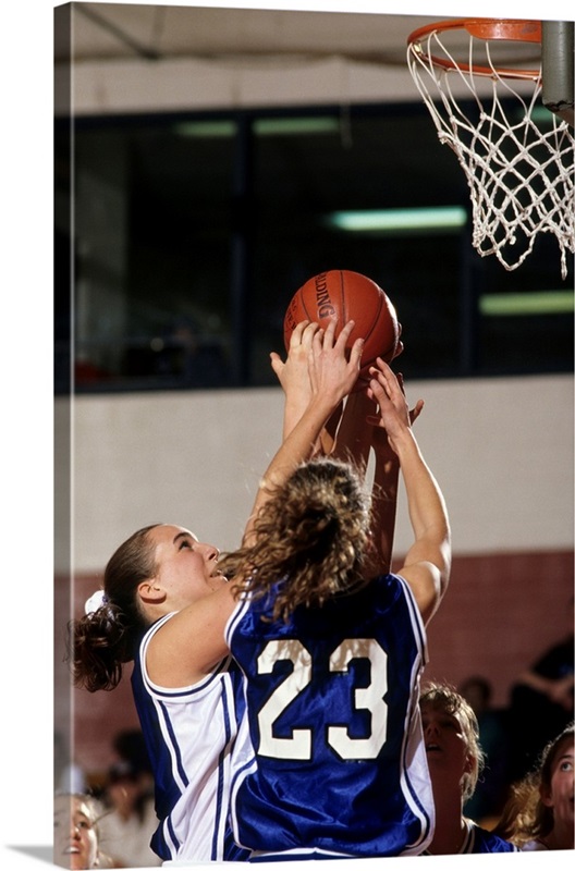 Female High School basketball players in action during a game | Great ...