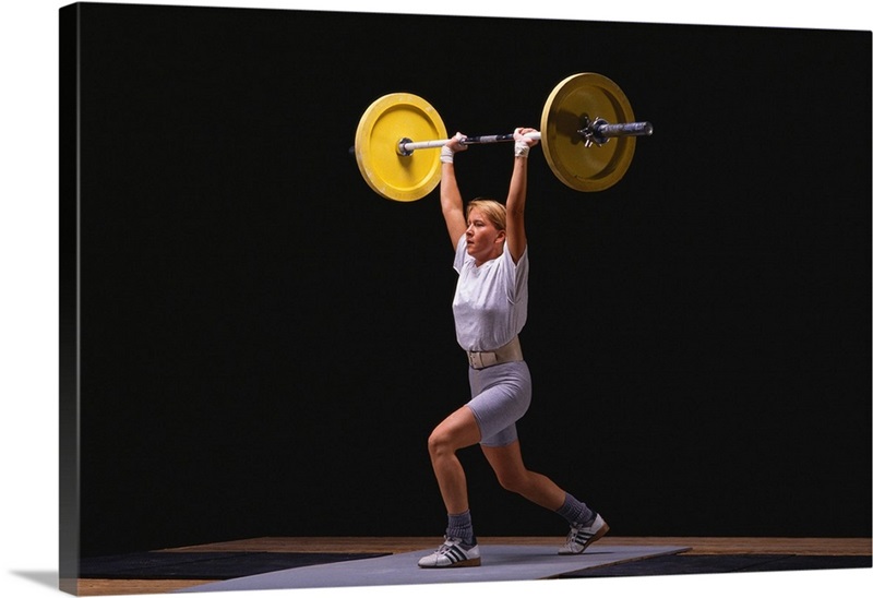 Female weightlifter in action | Great Big Canvas
