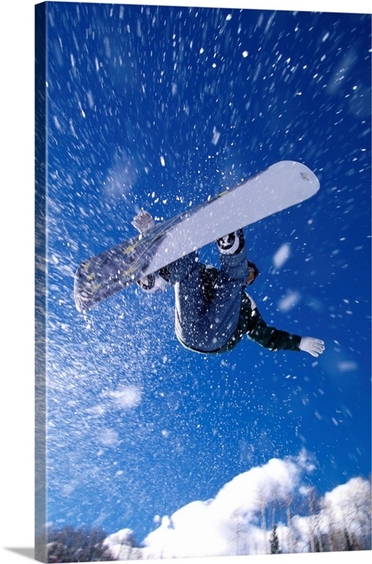 Male snowboarder flying through the air | Great Big Canvas