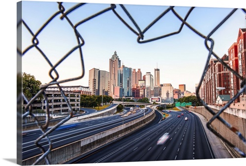 Atlanta, Georgia skyline framed by a chain link fence | Great Big Canvas