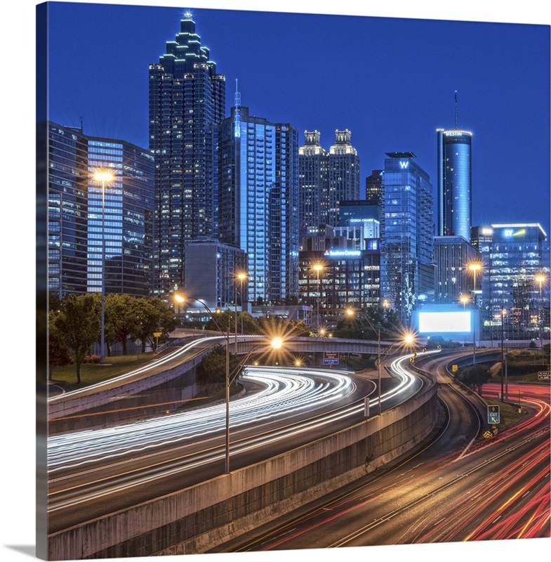 Skyline of Atlanta, Georgia, at night with light trails in the streets ...