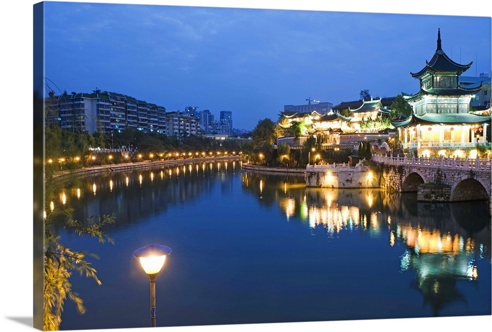 A riverside pavilion illuminated at night in Guiyang city, Guizhou ...