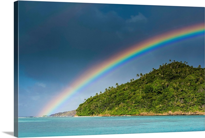 Rainbow over an islet off Ofu Island, Manua Island group, American ...