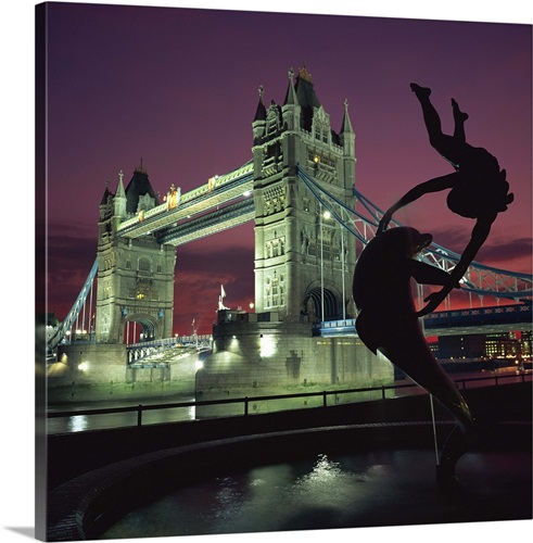 Silhouetted fountain statue and Tower Bridge, London, England, UK ...